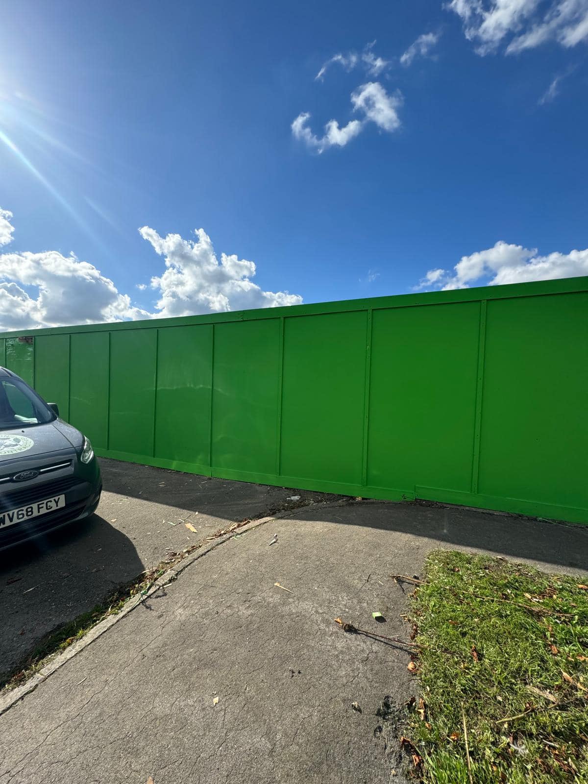 Hoarding repainted after repair - Conservation Contractors